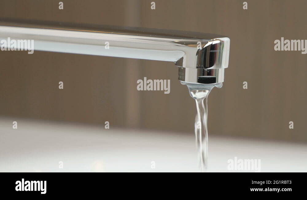 Water weak pressure flows from a water tap Stock Video Footage - Alamy