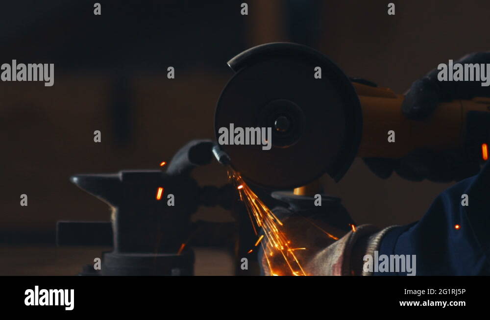 Manual sharpening and cutting of metal by grinding machine Stock Video ...
