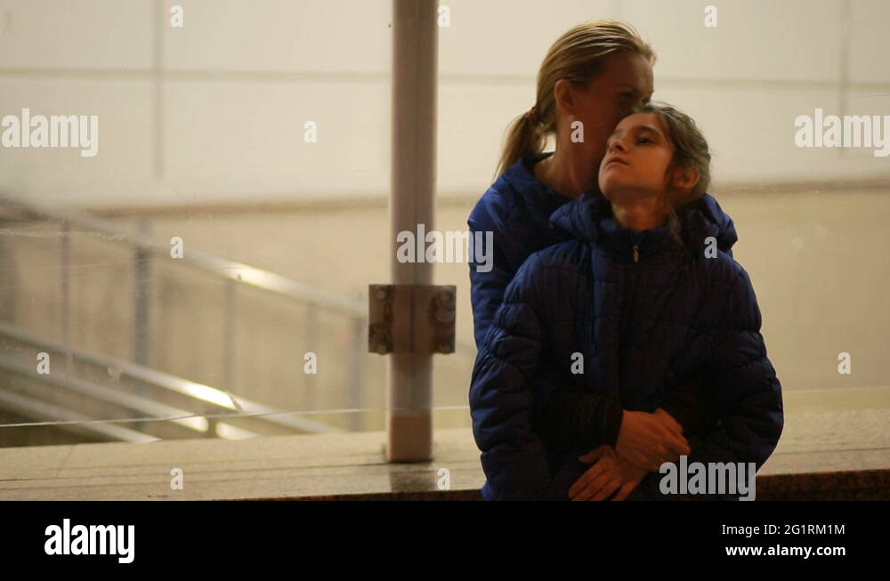people sit in a underground pedestrian crossing in the night city Stock ...