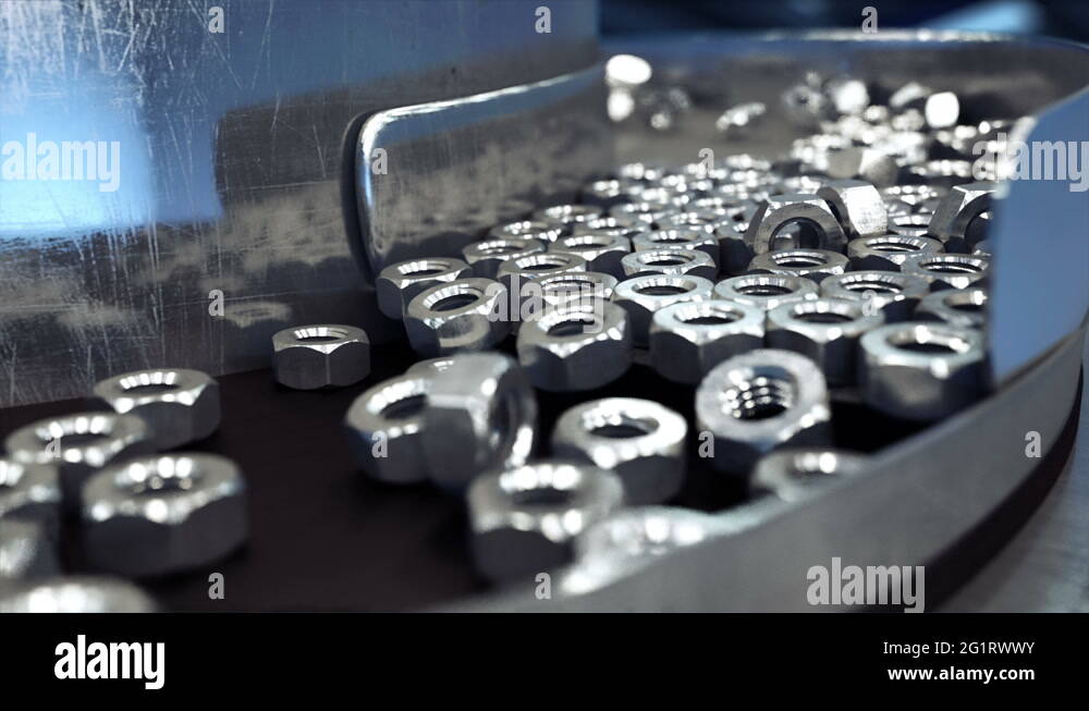 Process of production of nuts, screws. Industrial concept. Factory ...