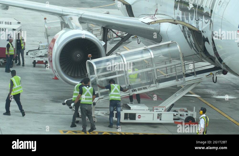 Airport Staff Loading Baggage into Plane in Airport Stock Video Footage ...