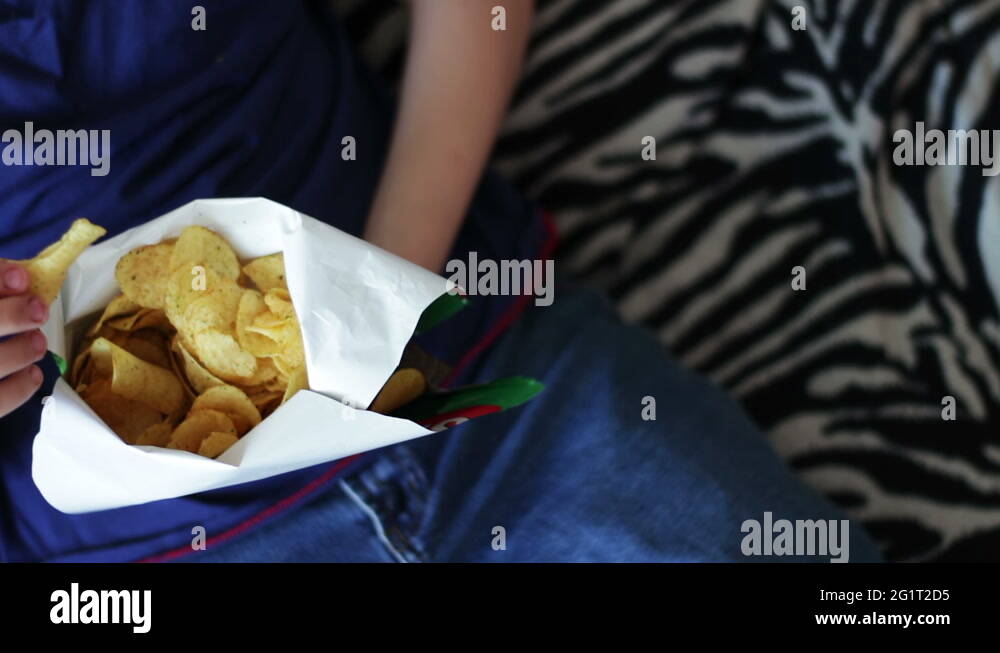 Boy Eating Packet Of Potato Chips unhealthy food Stock Video Footage ...