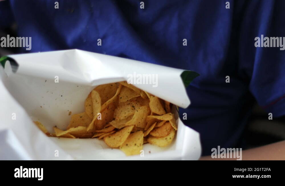 Boy Eating Packet Of Potato Chips unhealthy food Stock Video Footage ...