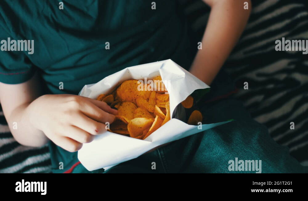 Boy Eating Packet Of Potato Chips unhealthy food Stock Video Footage ...