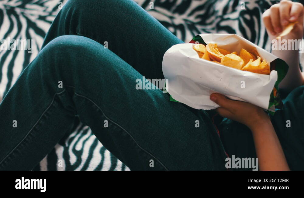 Boy Eating Packet Of Potato Chips unhealthy food Stock Video Footage ...