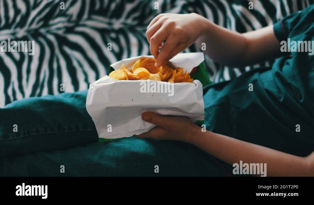 Boy Eating Packet Of Potato Chips unhealthy food Stock Video Footage ...