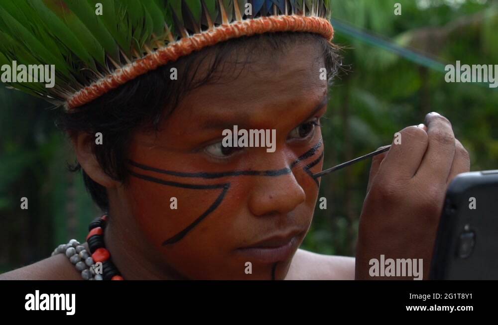 Native Brazilian Man (Indio) Painting on his Face in a Indigenous Tribe ...
