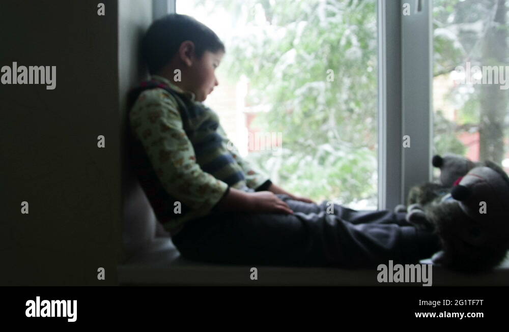 Boy in window Stock Videos & Footage - HD and 4K Video Clips - Alamy