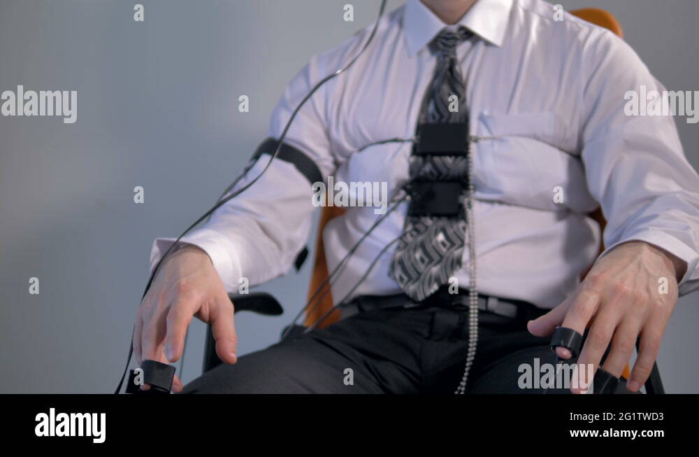 Low angle pan of the man connected to the lie detector circuit. 4K ...
