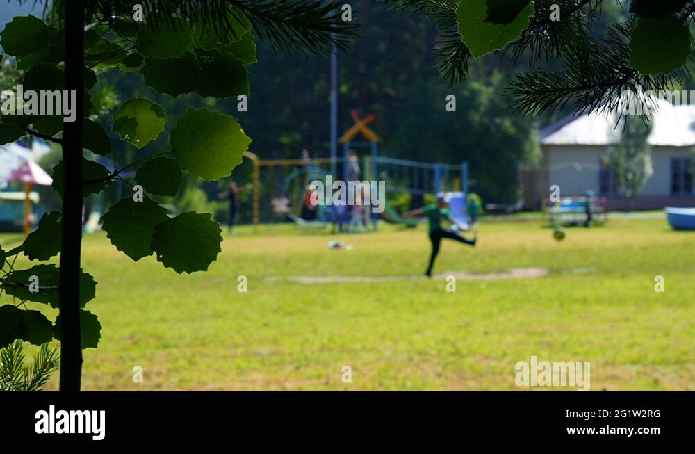 Children playing football (soccer) outside Stock Video Footage - Alamy