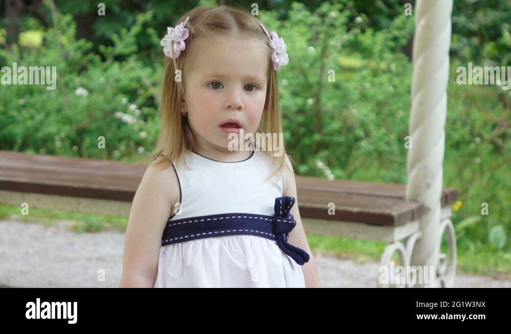 Girl child sighs on nature Stock Video Footage - Alamy