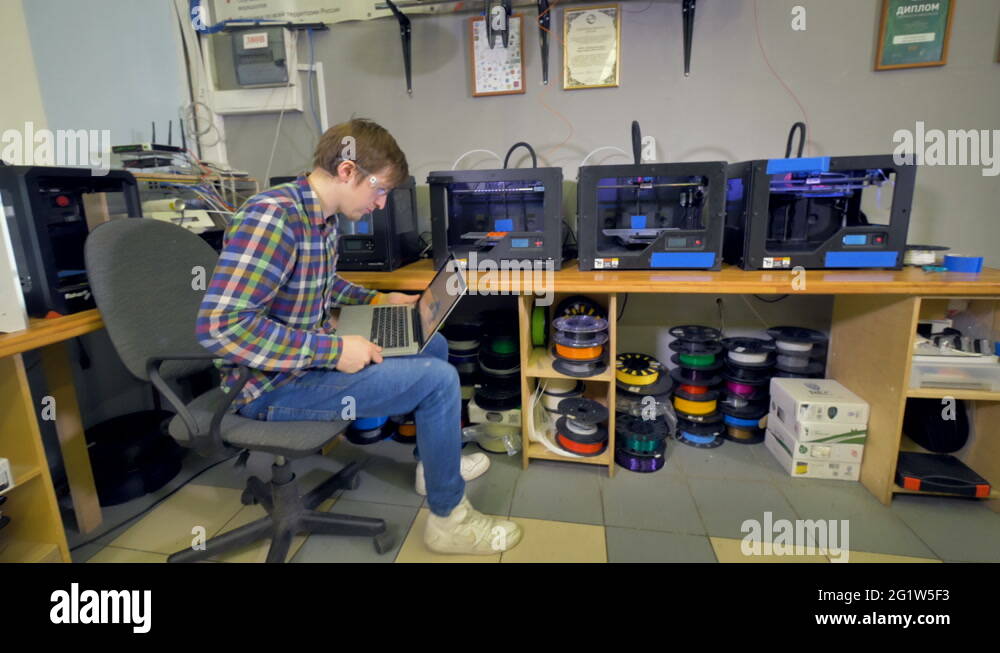 A man in charge of a 3d-printing process Stock Video Footage - Alamy