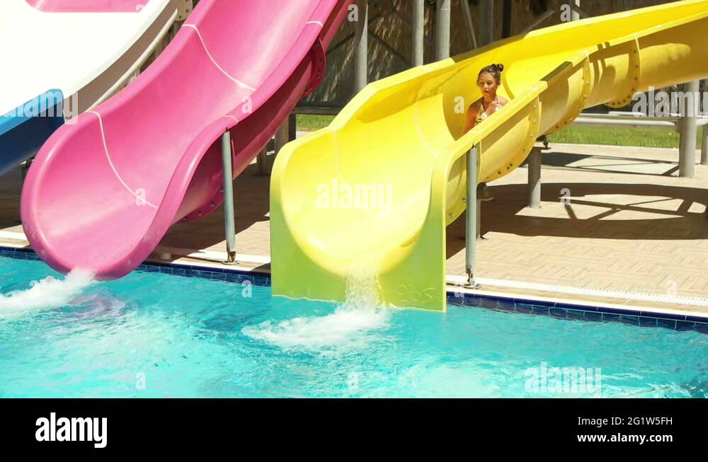 kid on a water slide, slow motion Stock Video Footage - Alamy