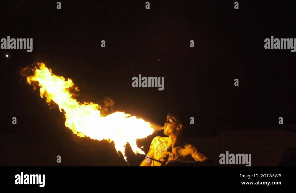 Fiery dance. Amazing magical Fire Show at night. Slow shutter speed ...