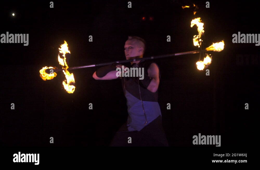 Fiery dance. Amazing magical Fire Show at night. Slow shutter speed ...