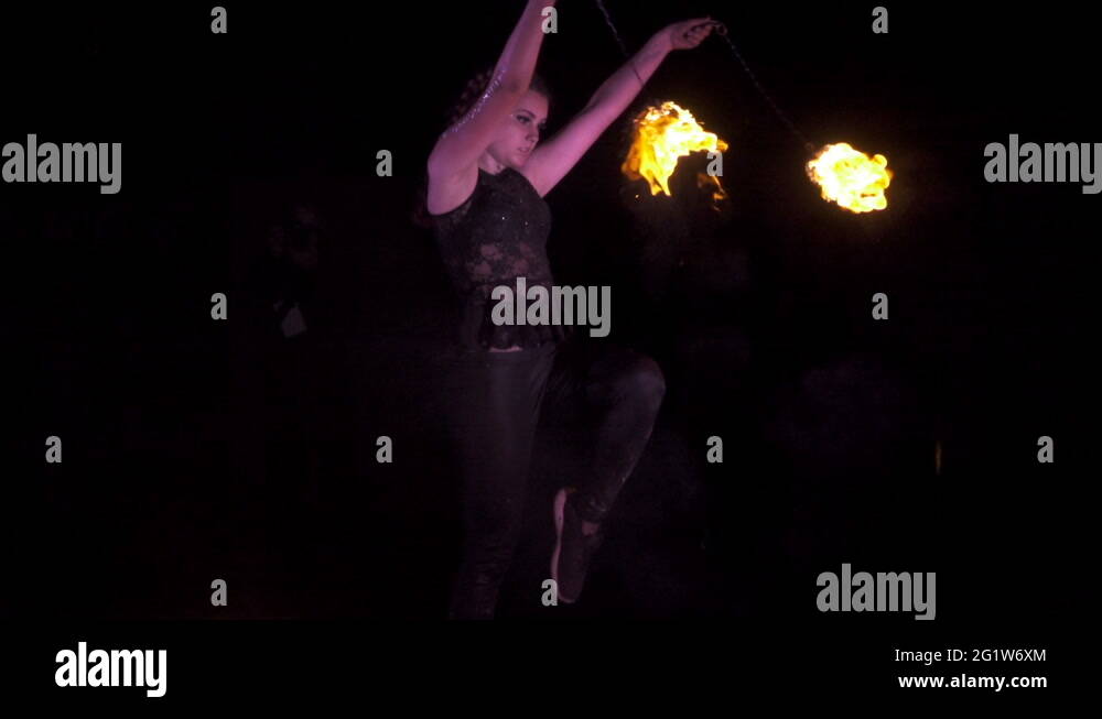 Fiery dance. Amazing magical Fire Show at night. Slow shutter speed ...