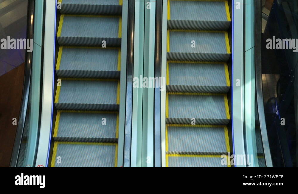 The escalator mechanism movement step climbing Stock Video Footage - Alamy