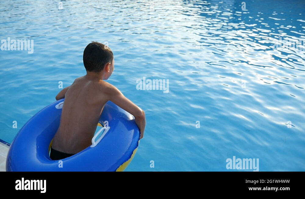 Boy inflatable ring Stock Videos & Footage - HD and 4K Video Clips - Alamy