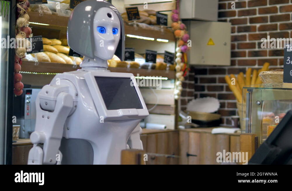 A white robot works at a bakery counter Stock Video Footage - Alamy