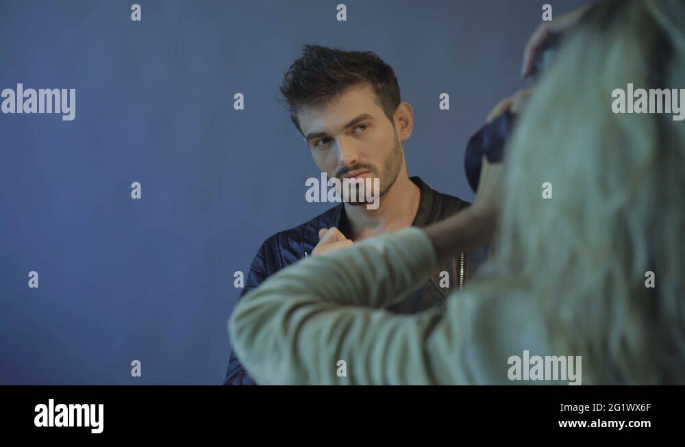 Handsome male model poses for photosession in studio 4K Stock Video ...