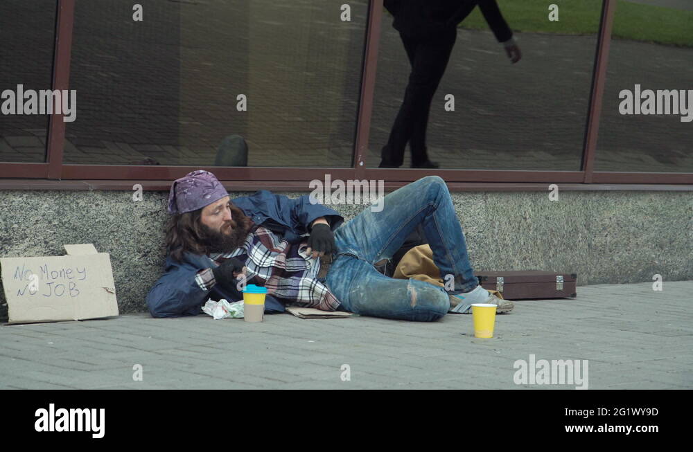 Giving money homeless Stock Videos & Footage - HD and 4K Video Clips ...