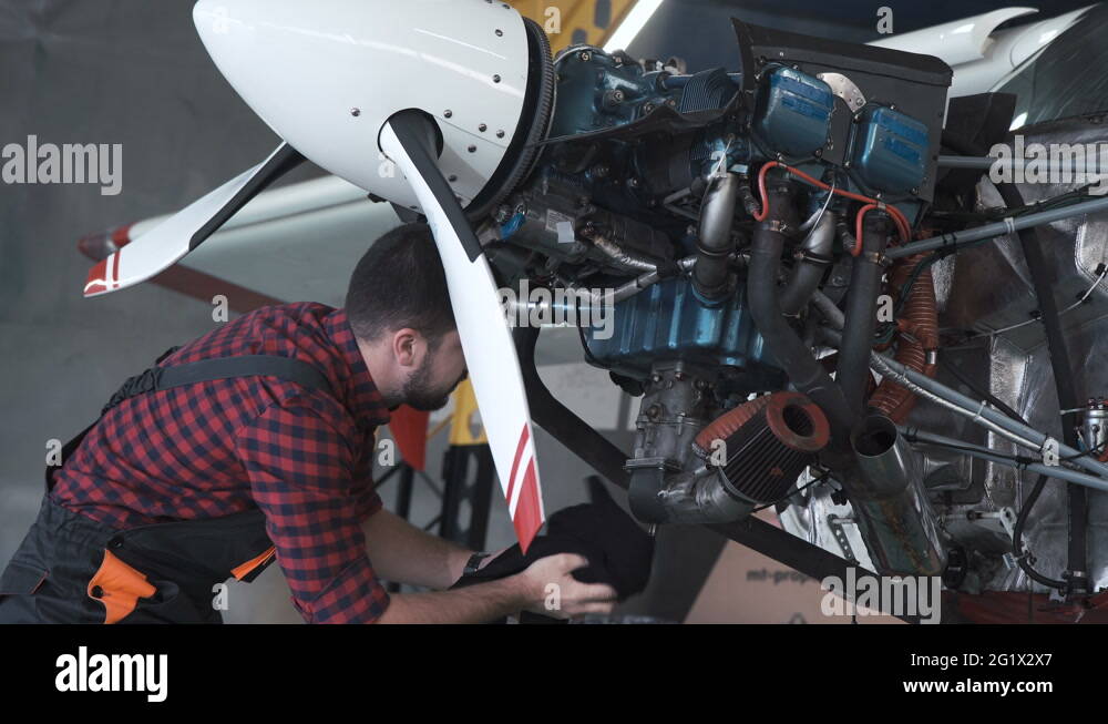 Man cleaning aircraft engine in hangar Stock Video Footage - Alamy