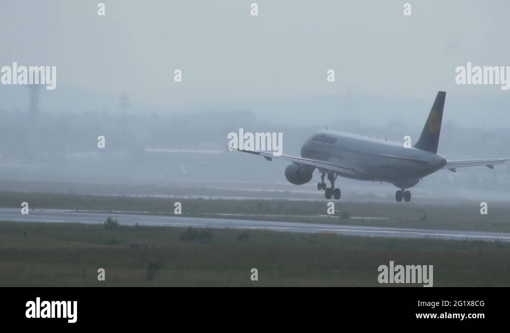 Airbus A320 landing through the rain Stock Video Footage - Alamy
