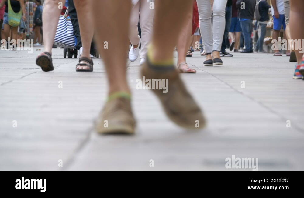 Legs of Crowd People Walking on the Street in Slow Motion Stock Video ...
