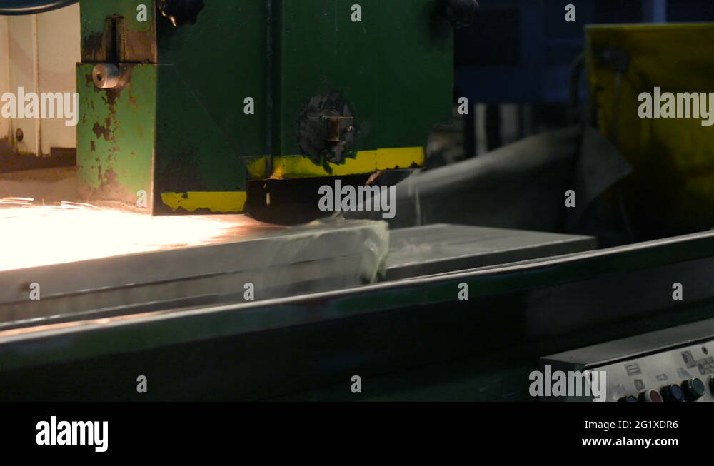 Work of an industrial surface grinding machine. Grinding of a flat ...