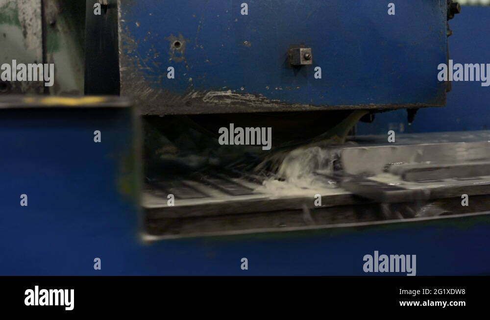 Work of an industrial surface grinding machine. Grinding of a flat ...