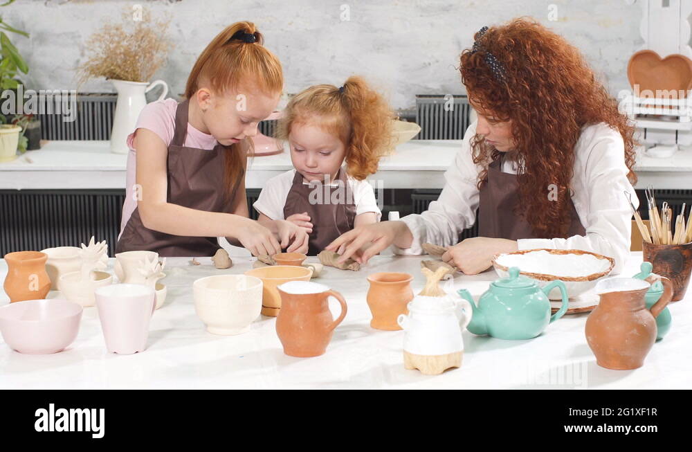 Pottery class workshop. Clay shaping on potter's wheel and firing Stock ...