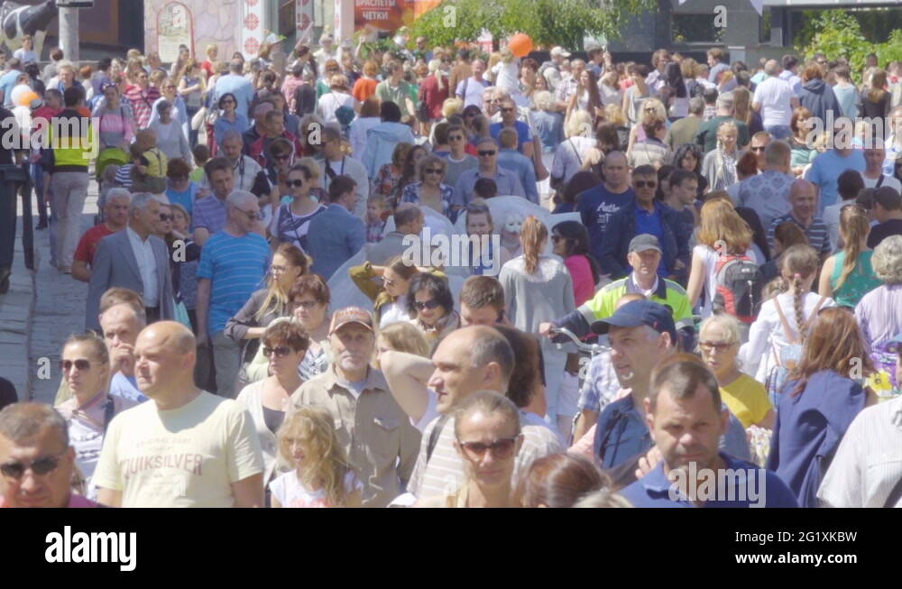 Street filled with a very busy crowd. City pedestrian. Large mass of ...