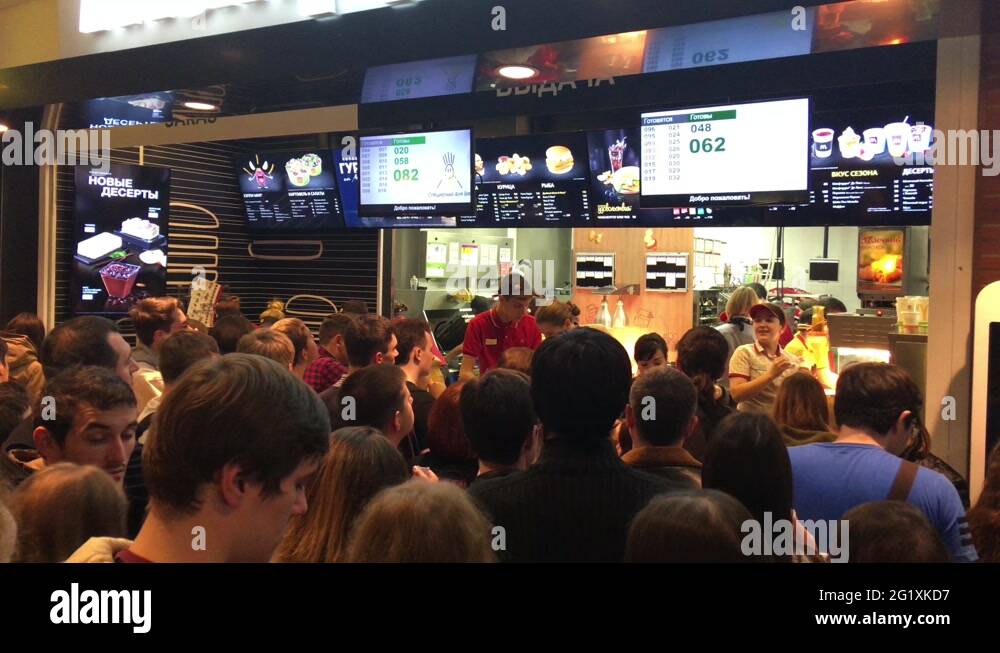Many visitors of Mcdonalds, huge crowd in fast food restaurant Stock ...