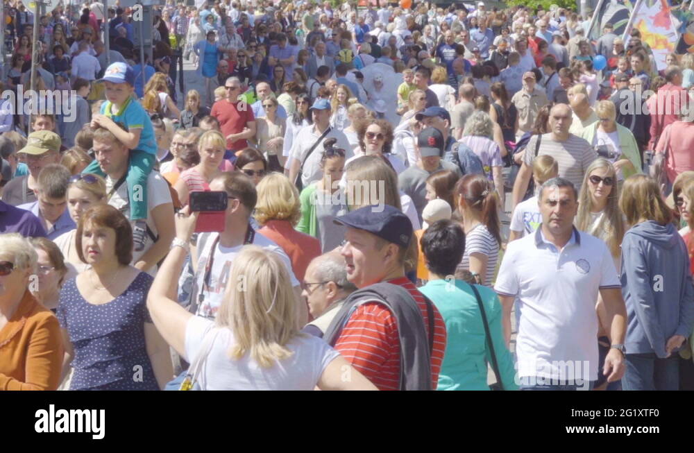 Street filled with a very busy crowd. City pedestrian. Large mass of ...