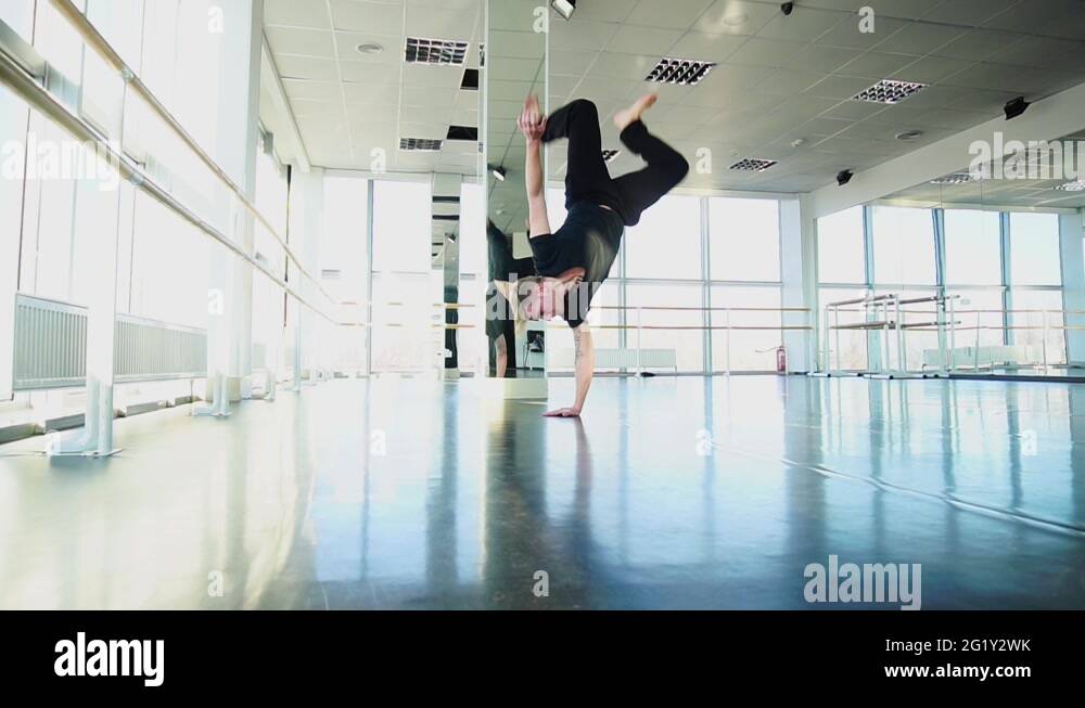 Male dancer making one arm handstand Stock Video Footage - Alamy