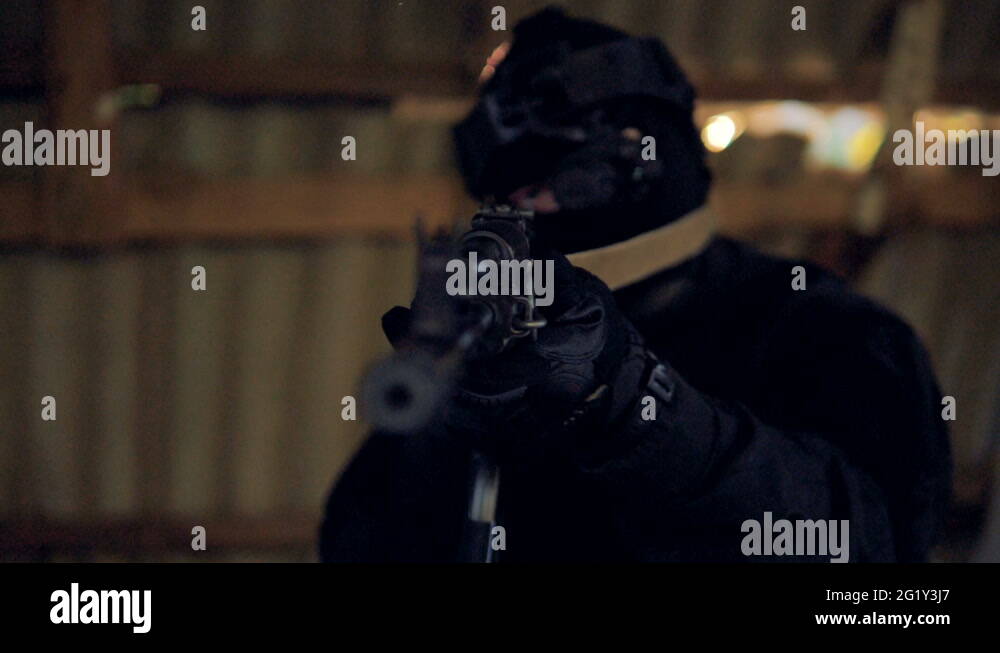 A fighter with a tactical infrared camera points his rifle Stock Video ...