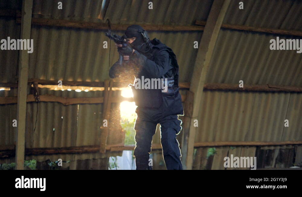 An armed fighter walks forward with an automatic rifle Stock Video ...