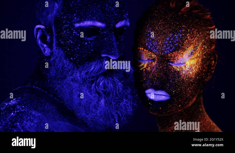 Man and woman face in ultraviolet light Stock Video Footage - Alamy