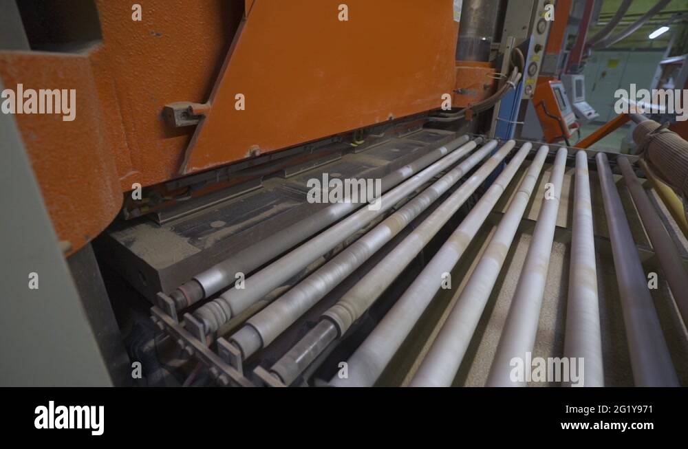 Production of ceramics, automatic machine produces ceramic tiles ...