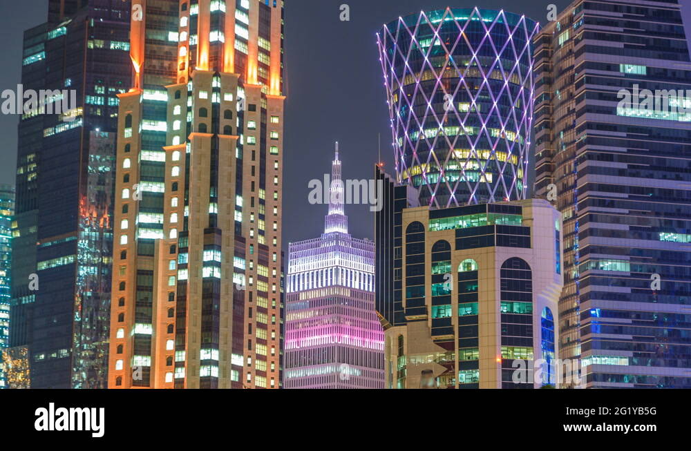 The skyline of Doha by night with starry sky seen from Park timelapse ...