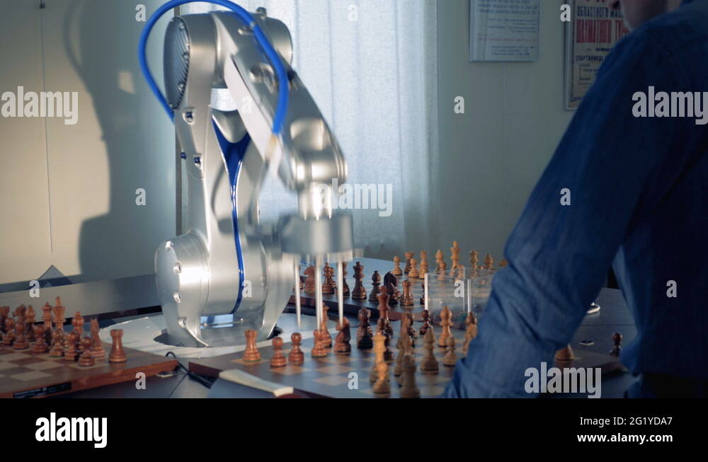 Robot hand, robotic arm playing chess witha man. Futuristic concept ...