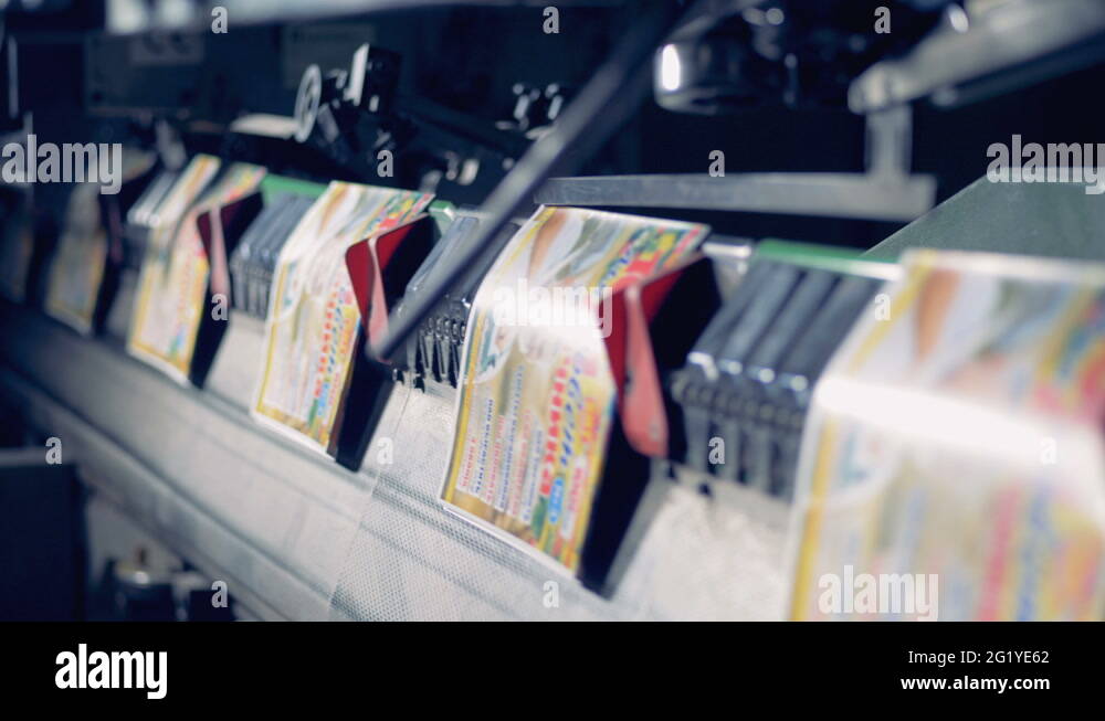 Offset production conveyor. Ready made magazines on a conveyor belt ...