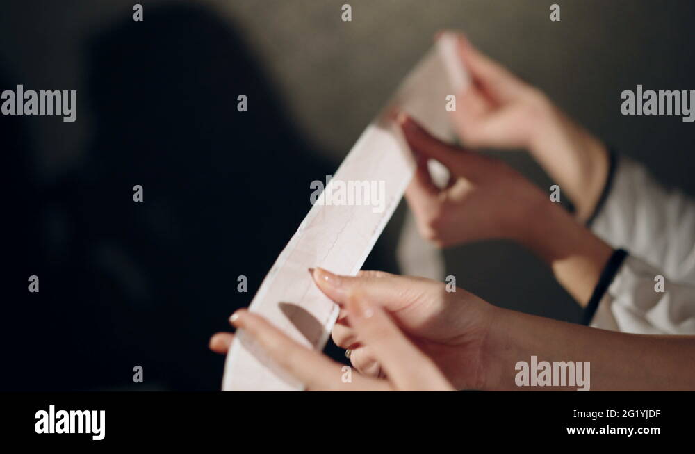 Electrocardiogram, ecg in hand, palm of a doctor Stock Video Footage ...