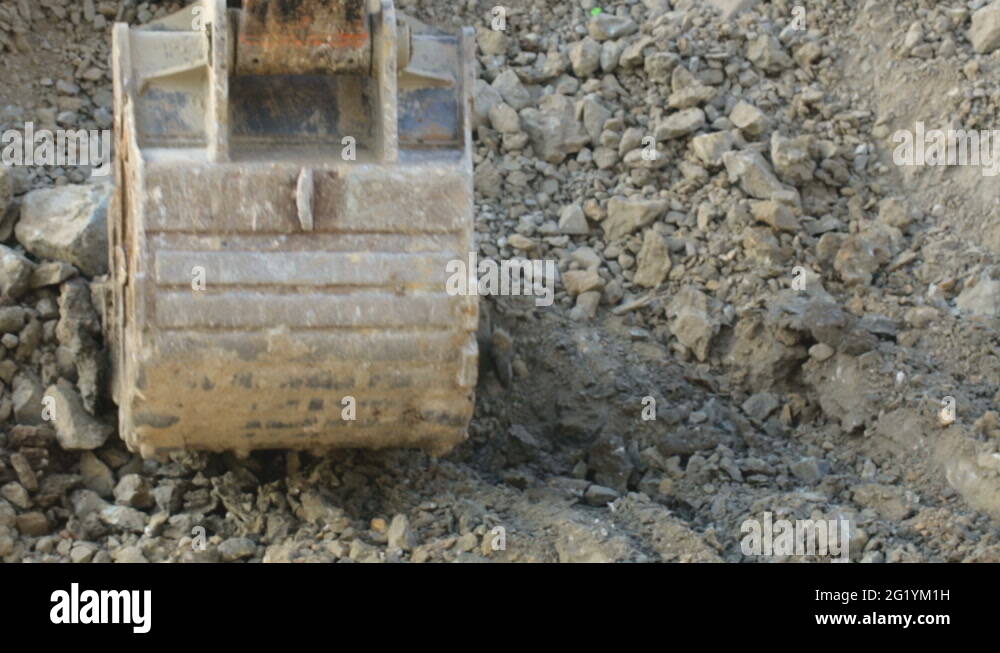 Excavator digging the ground Stock Video Footage - Alamy