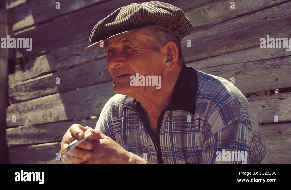 Farmer smoking a cigarette Stock Video Footage - Alamy