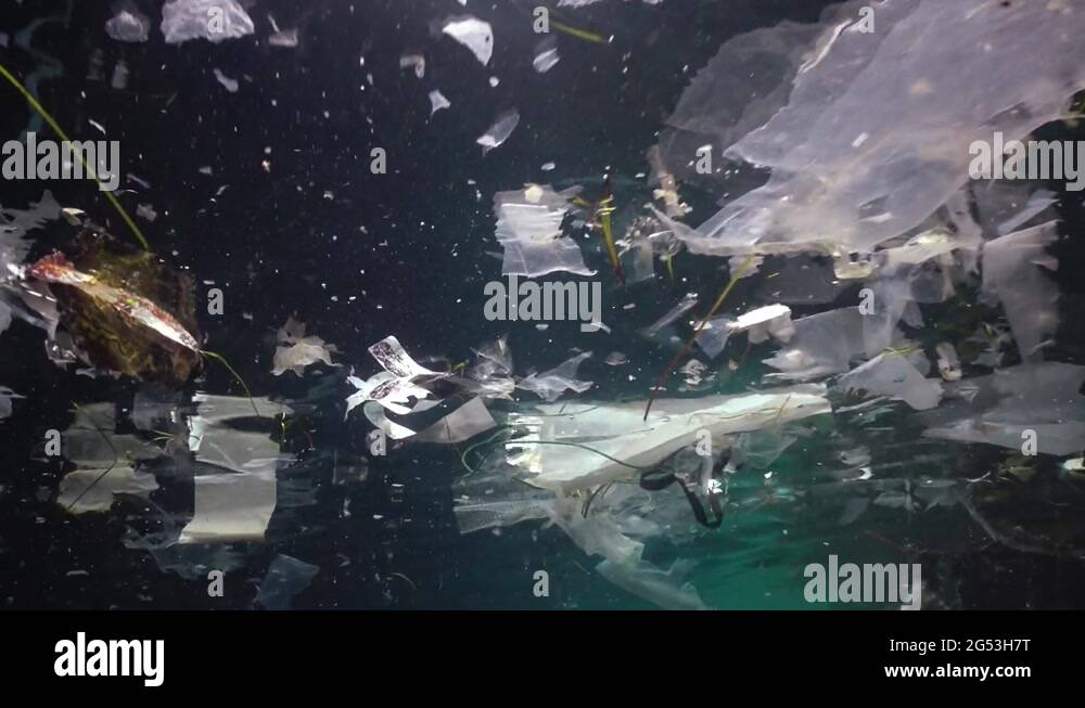 Plastic garbage and other debris floating underwater. Marine pollution ...