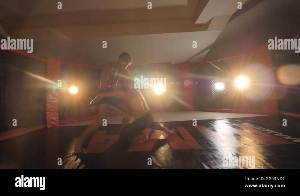 Boxer throws down opponent to a mma ring floor after knockout punch. 4K ...