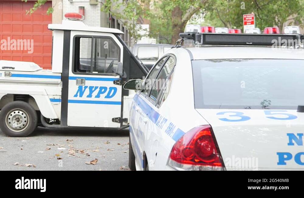 NYPD Police Car and Interceptor 3 Scooter with People Passing in ...