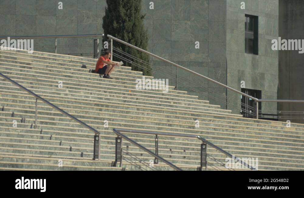 Man sitting on stairs Stock Videos & Footage - HD and 4K Video Clips ...