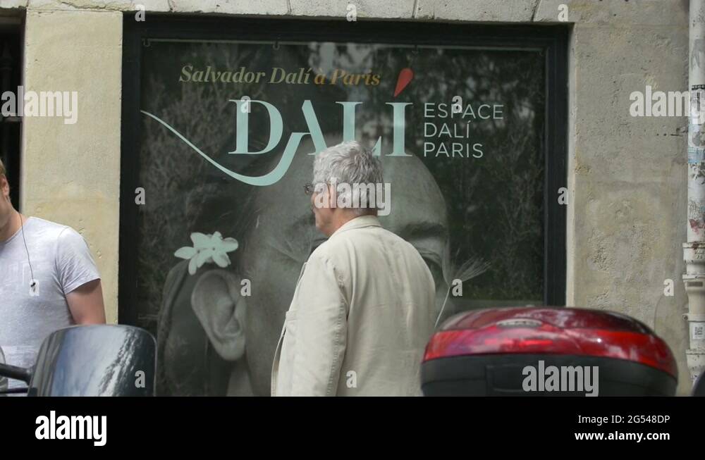 Man looking at a poster of Salvador Dali Stock Video Footage - Alamy
